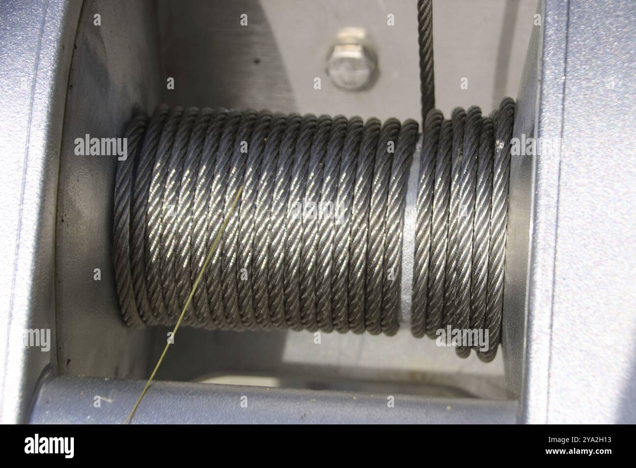 Wire rope from a cable winch is wound up next to each other Stock Photo ...