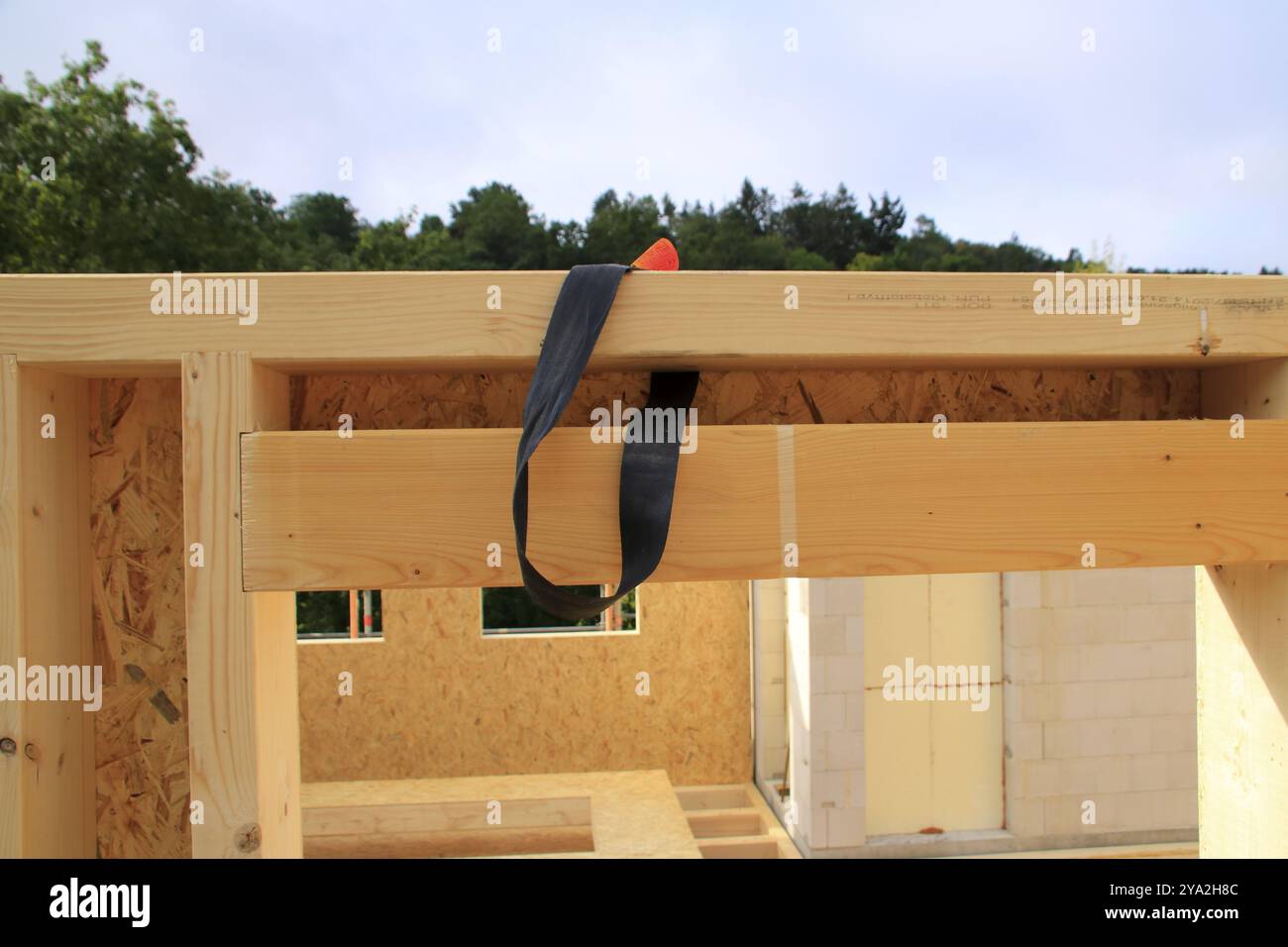 Belt for transporting wooden walls on a construction site Stock Photo ...