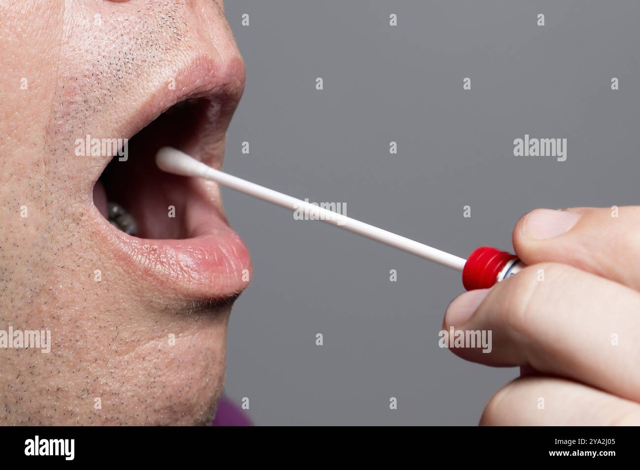 Man uses a DNA test tube and a cotton swab, wipe test Stock Photo - Alamy