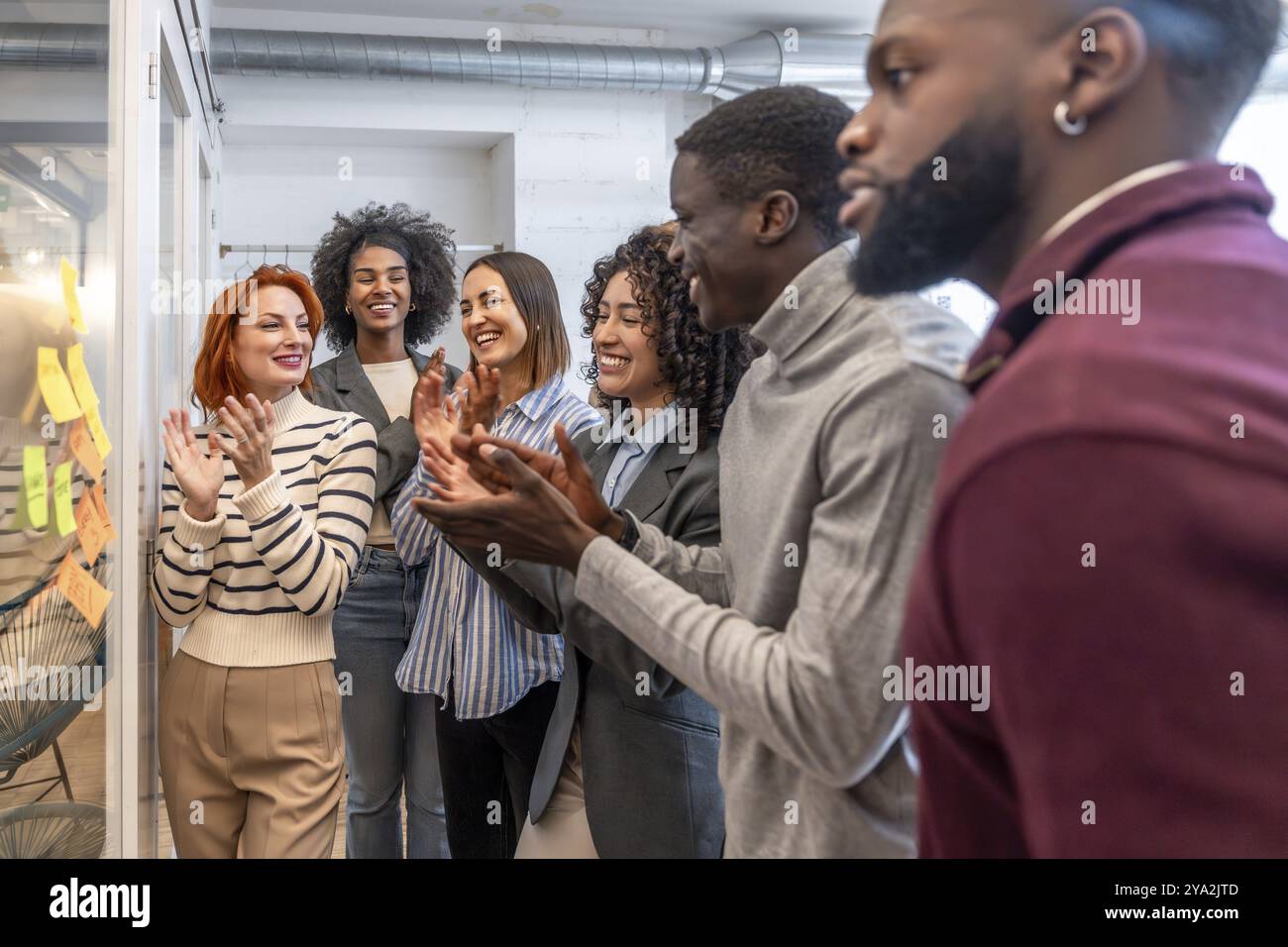 Diverse colleagues applauding at the end of creative brainstorming ...
