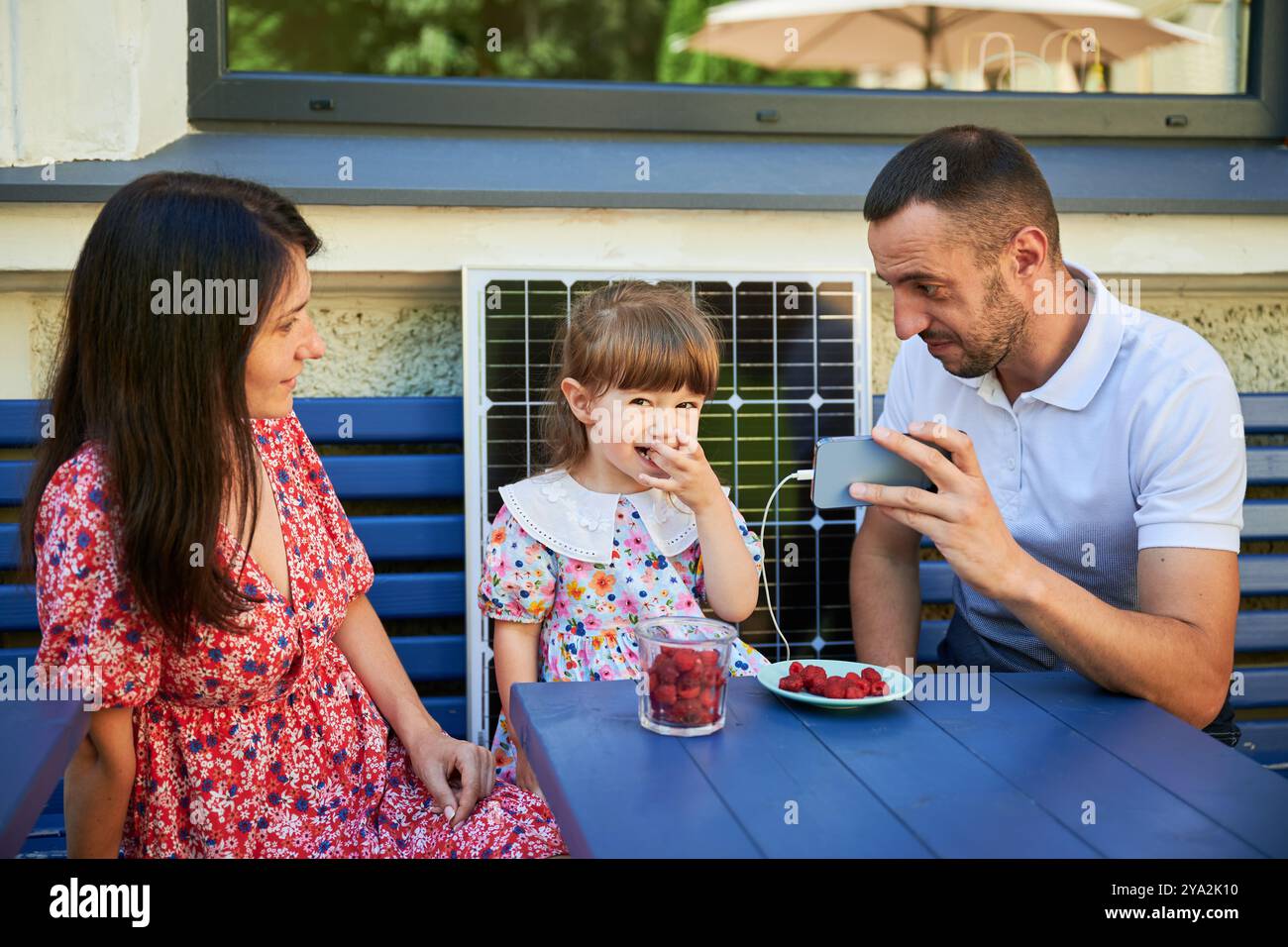 Lovely spending time with family. Young dad showing his daughter ...