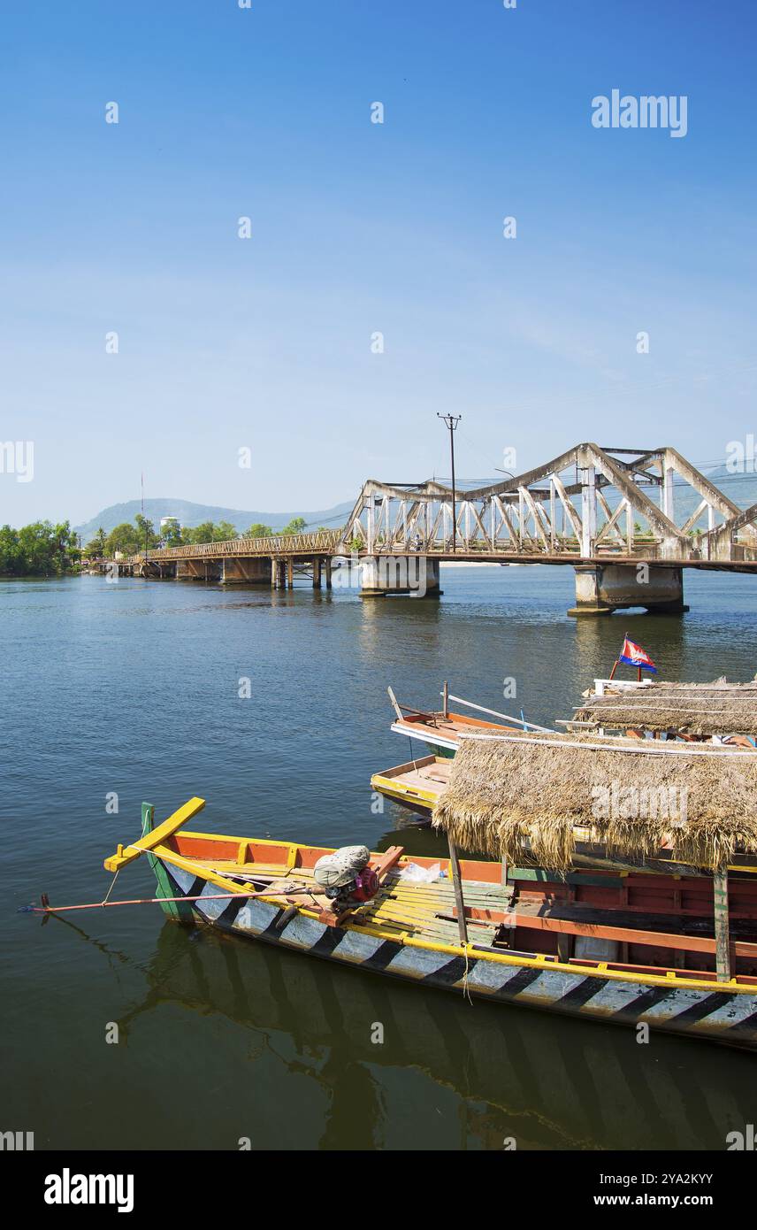 Kampot bridge and boat in cambodia Stock Photo - Alamy