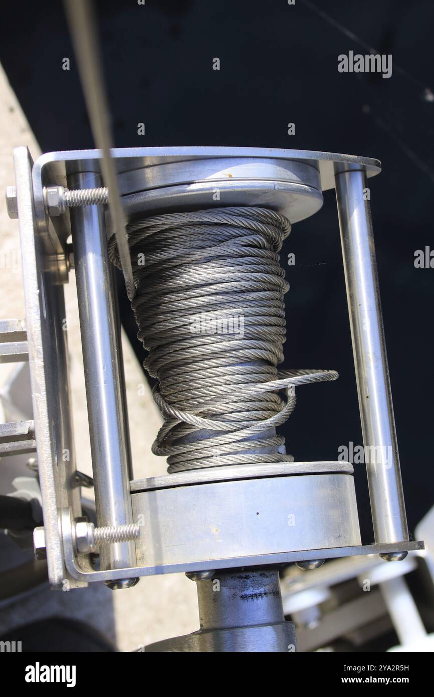 Wire rope from a cable winch is wound up in a mess Stock Photo - Alamy