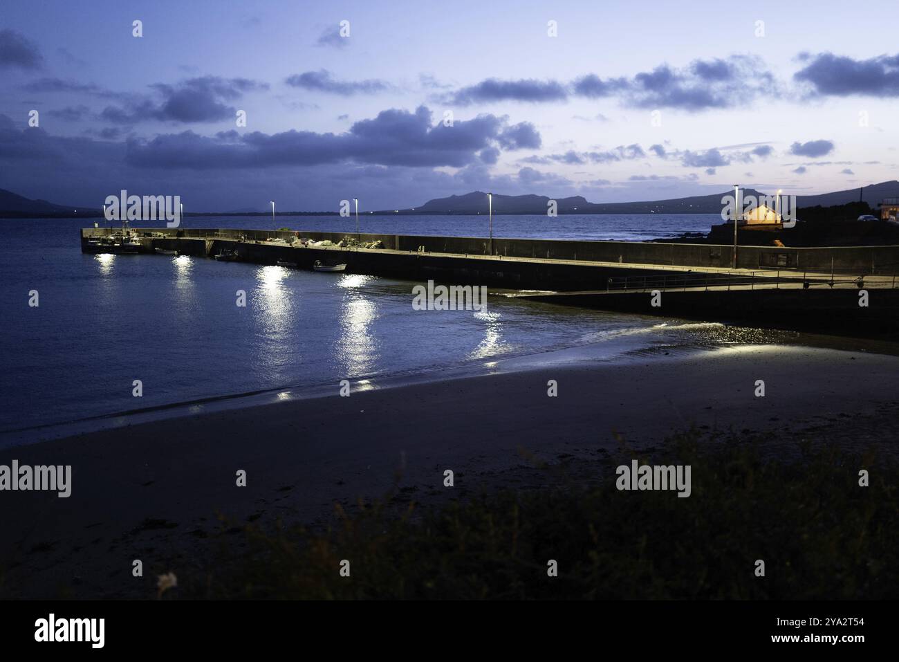 Baile na nGall (Ballydavid) pier at night with Smerwick Habour and the ...