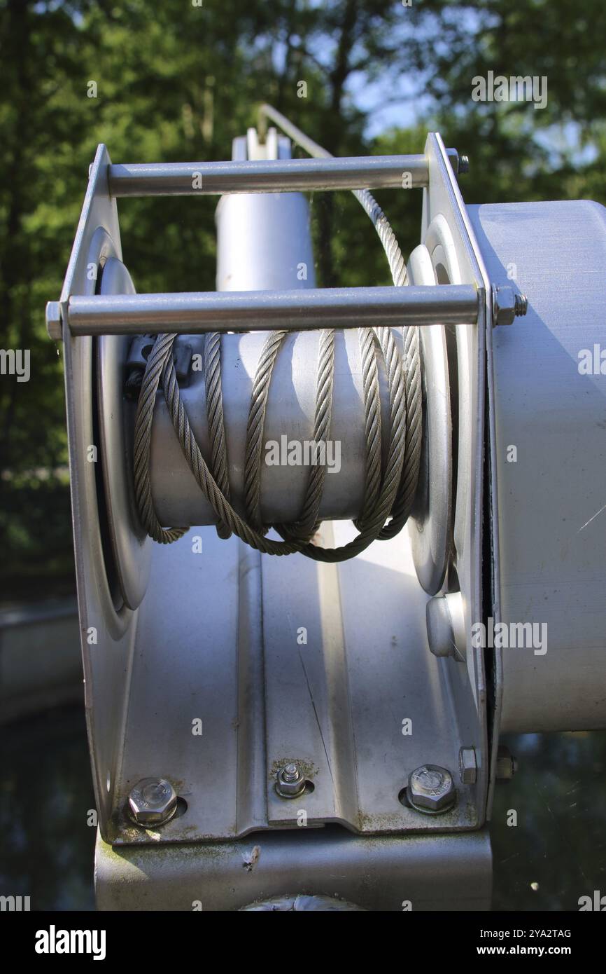 Wire rope from a cable winch is wound up in a mess Stock Photo - Alamy