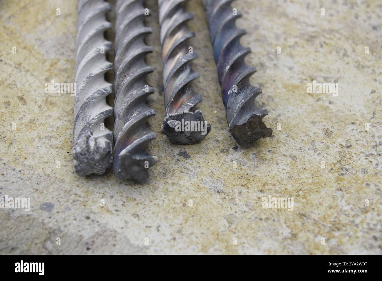 Drill bits for concrete are blunt and burnt at the tip Stock Photo - Alamy