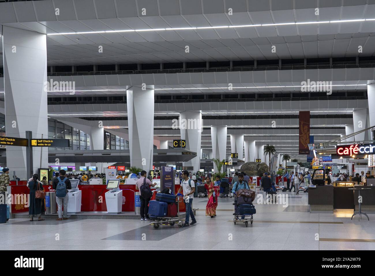Delhi, India, March 31, 2023: Group of people inside the check in hall ...