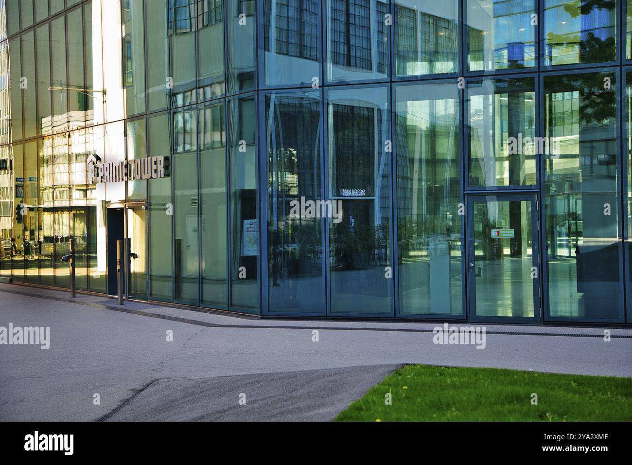 Entrance of the Prime Tower with modern glass facades and urban ...