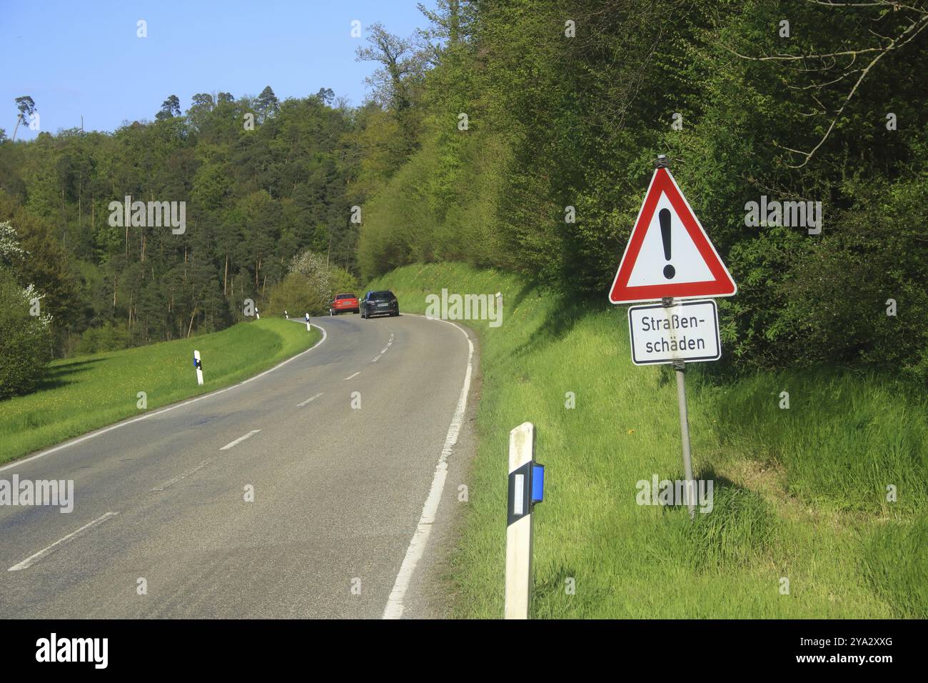 Traffic signs indicating road damage Stock Photo - Alamy