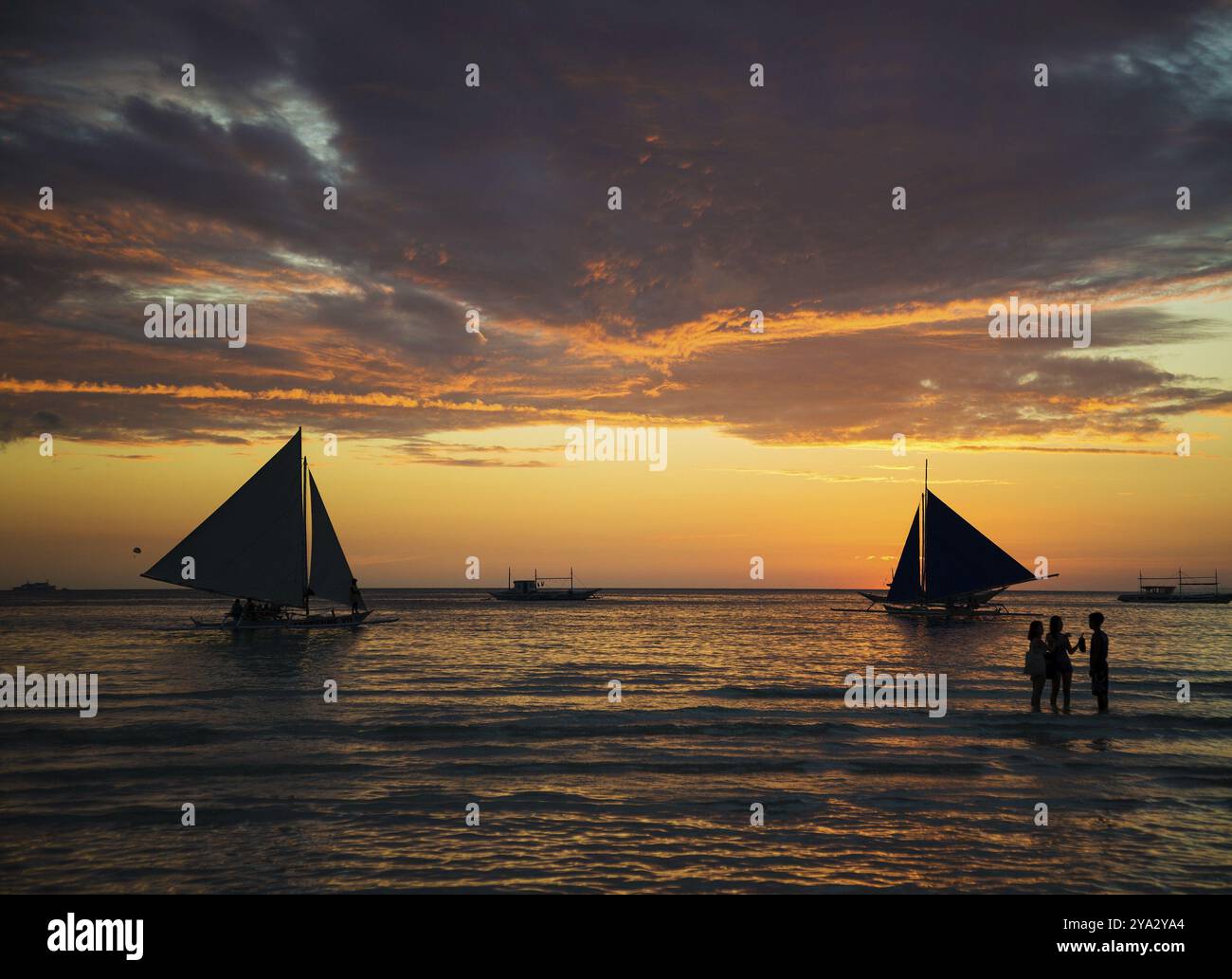 Sunset and sailing boats on white beach in boracay philippines Stock ...