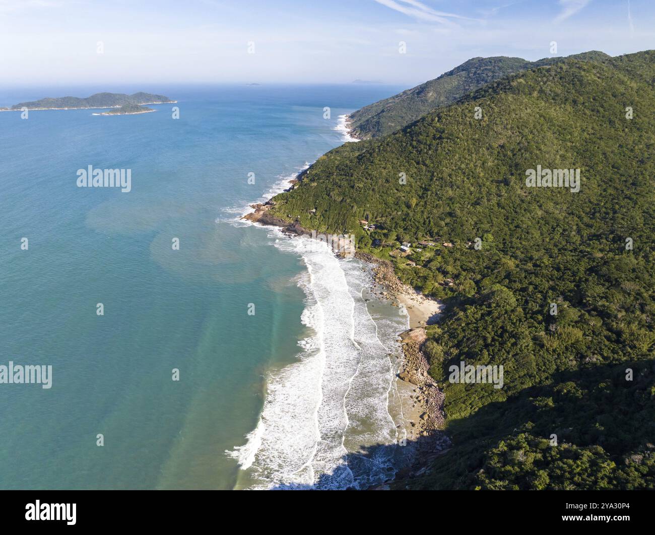 Coastline with beach, mountains and blue ocean with waves in Brazil ...