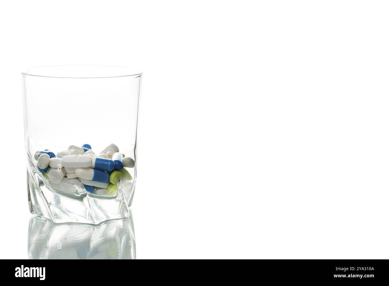 Many colourful tablets in a jar, isolated Stock Photo - Alamy