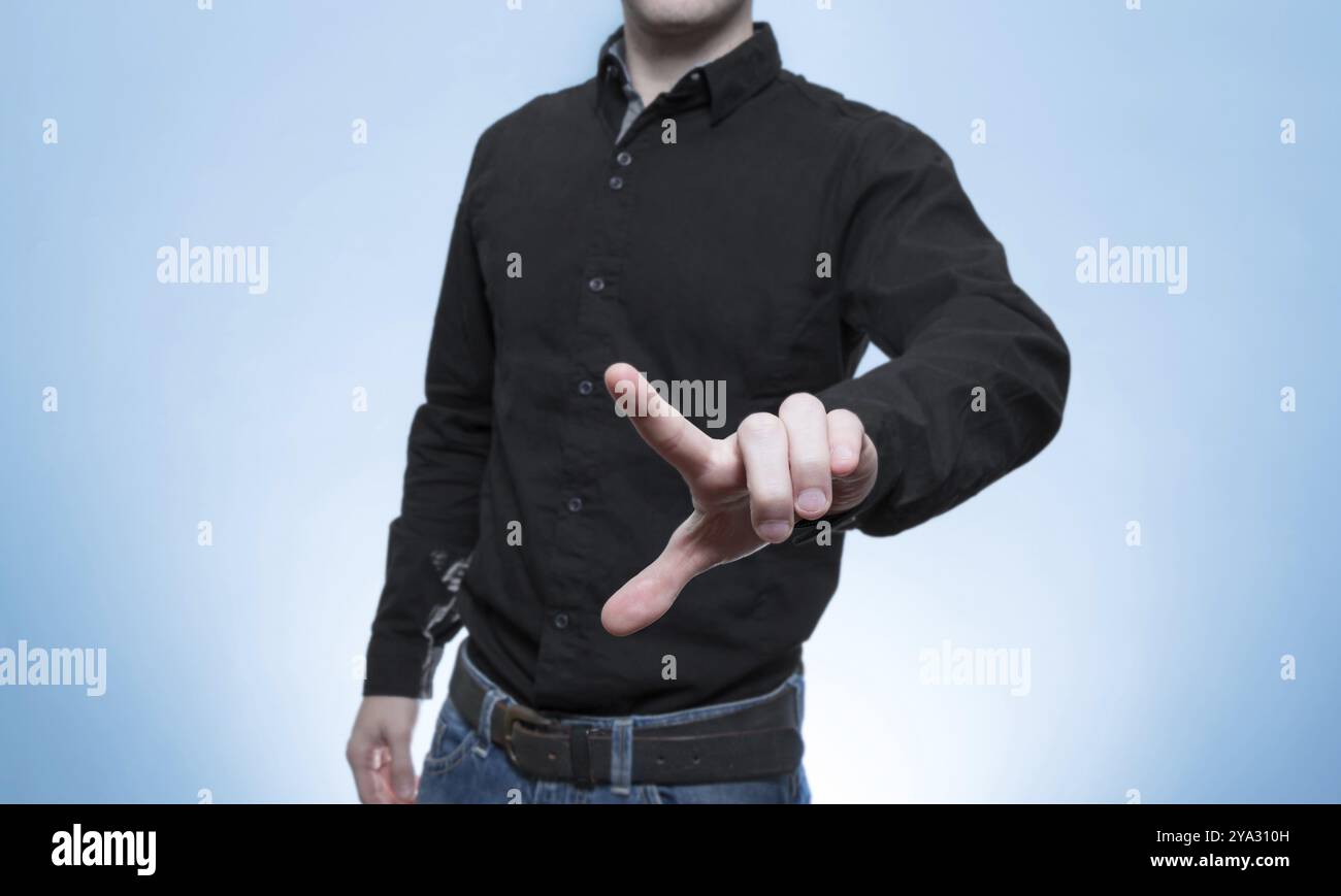 Man touches a virtual screen with his finger Stock Photo - Alamy