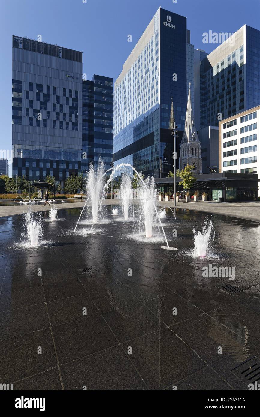 Architecture, square with fountain and modern clinic buildings ...