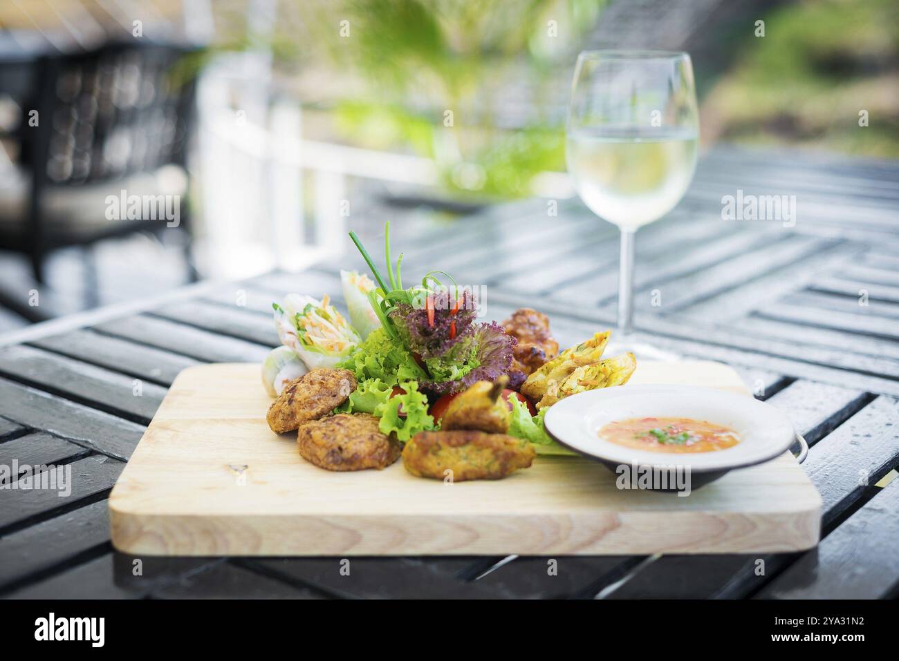 Mixed asian snack starters platter with spring rolls, prawn cakes ...