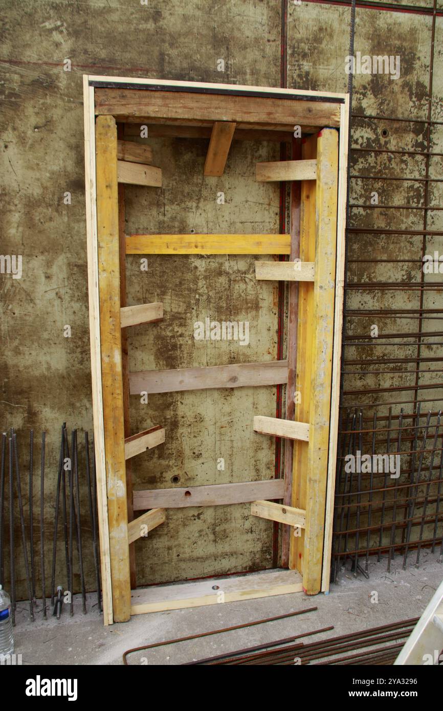 Prepared recess for a door in a concrete wall Stock Photo - Alamy
