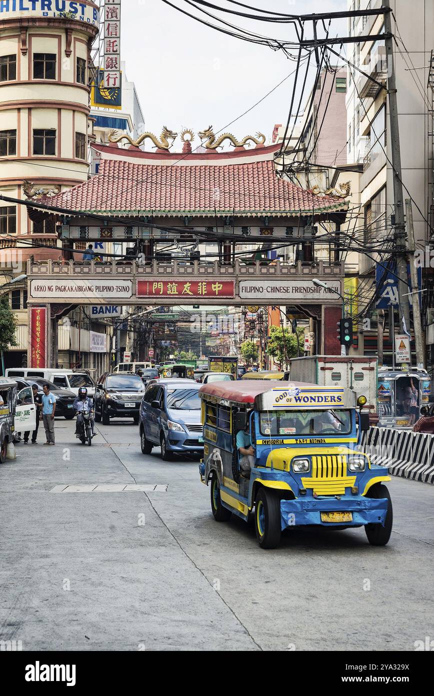 Jeepney and busy street urban traffic in central manila city chinatown ...