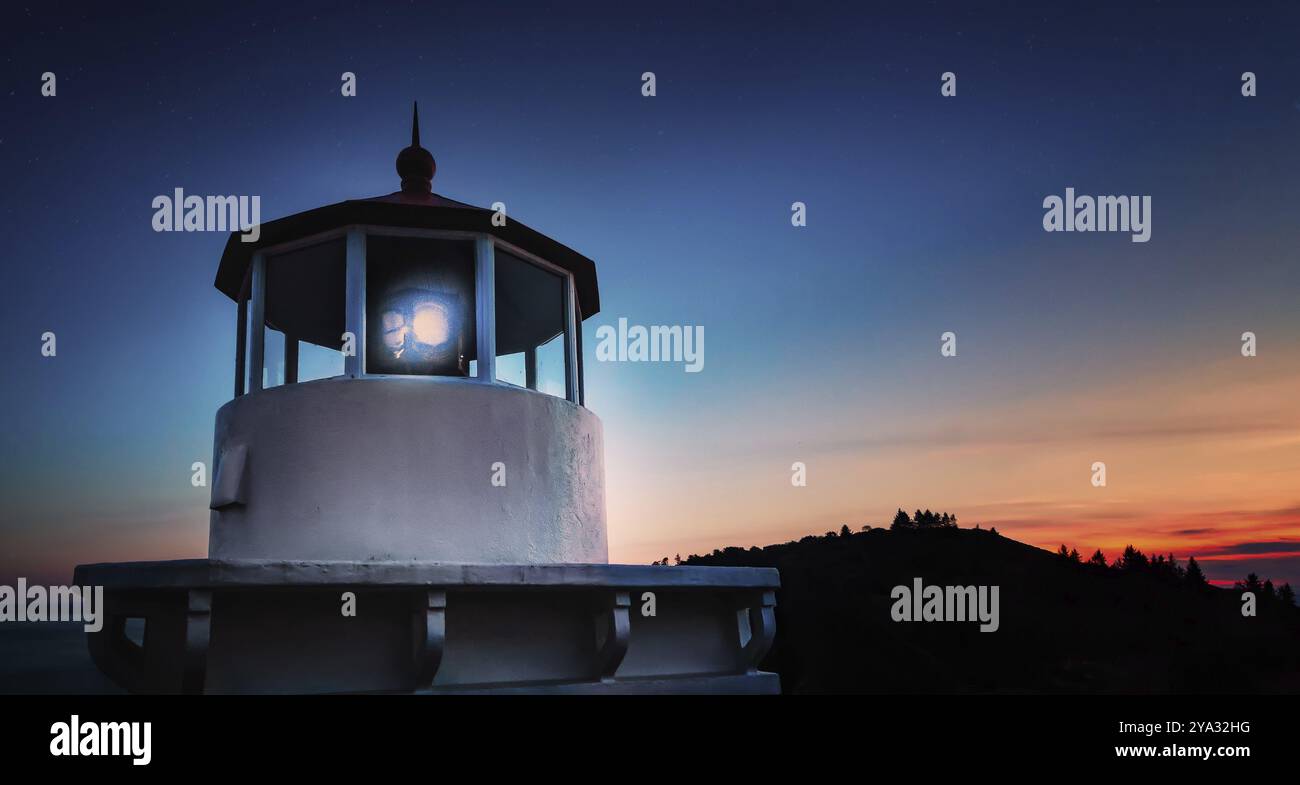 A Lighthouse shines at sunset. Color image Stock Photo - Alamy
