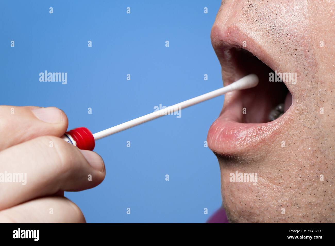 Man uses a DNA test tube and a cotton swab, wipe test COVID 19 Stock ...
