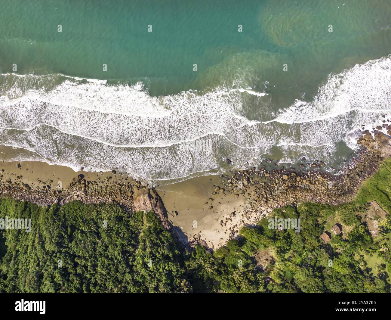 Coastline with beach, mountains and blue ocean with waves in Brazil ...