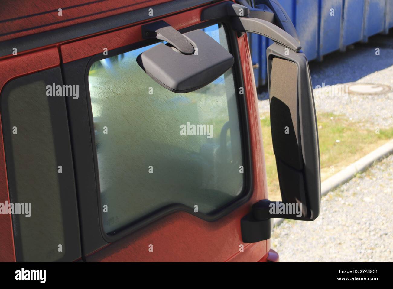Side windows and mirrors of a lorry are heavily soiled Stock Photo - Alamy