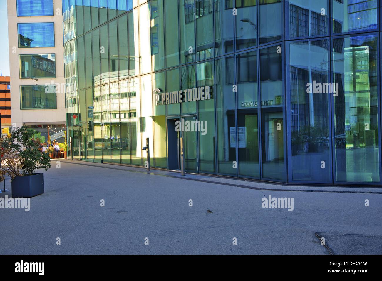 The entrance area of the Prime Tower with glass facades and urban ...