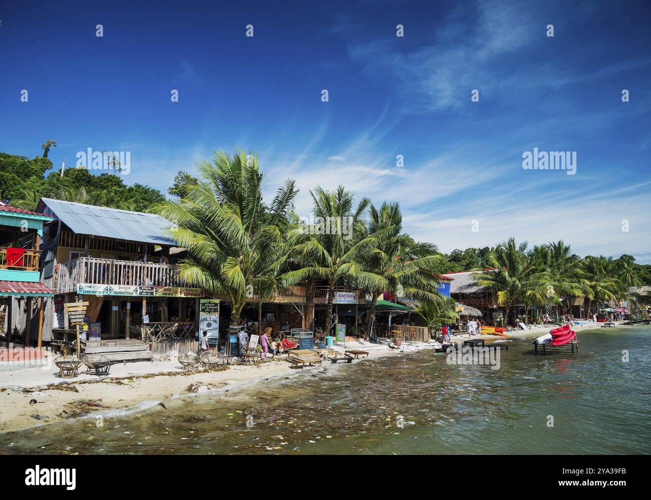 Polluted dirty beach with garbage rubbish floating in sea on koh rong ...
