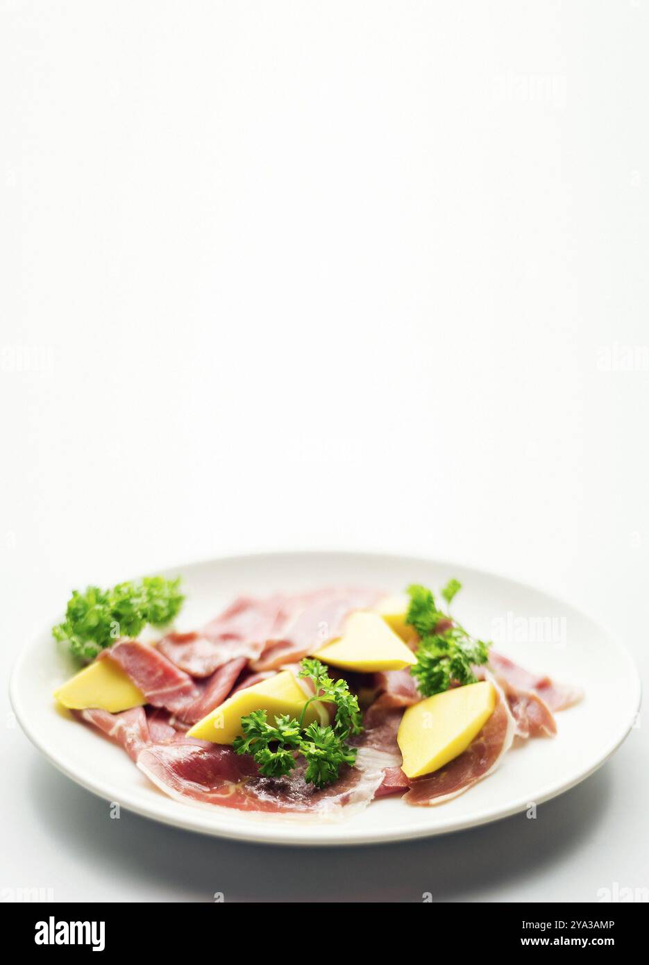 Cured parma serrano style ham with fresh mango salad snack starter ...