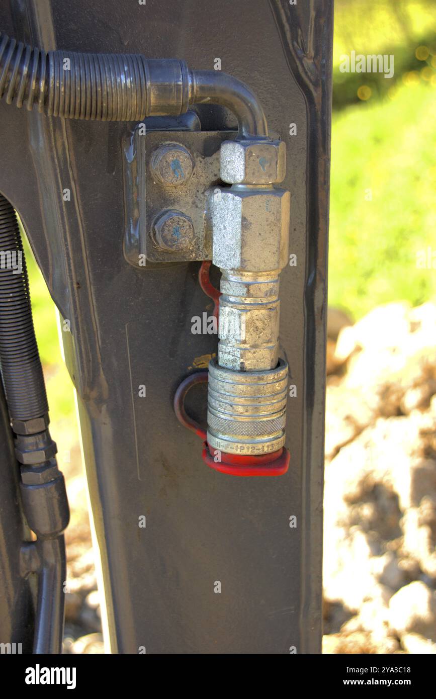 Hydraulic connection for a hydraulic hose on an excavator arm Stock ...