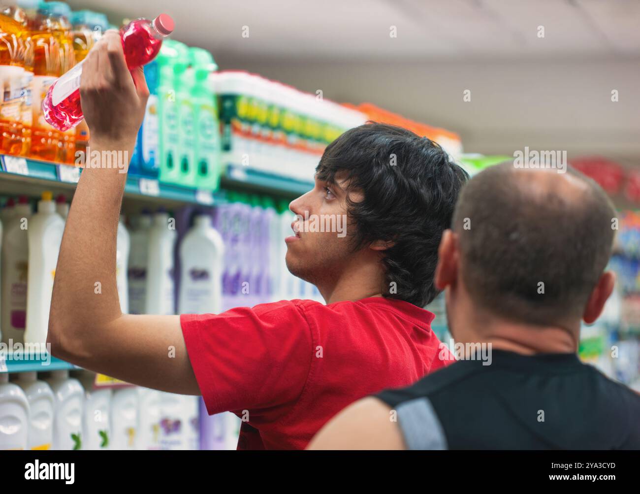 two man in the supermarket buying cleaning products, liquid soap Stock ...