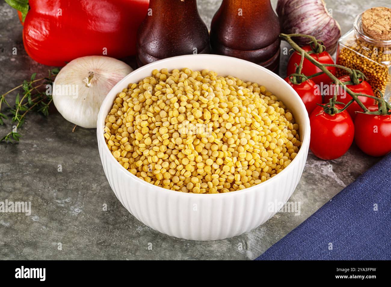 Dry ptitim heap in the bowl for cooking Stock Photo - Alamy