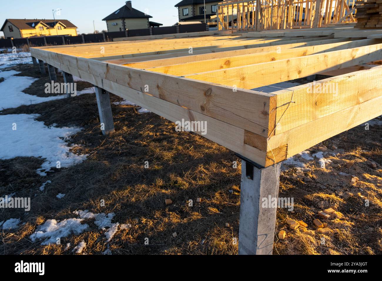 The foundation of a wooden frame house on stilts is a construction site ...