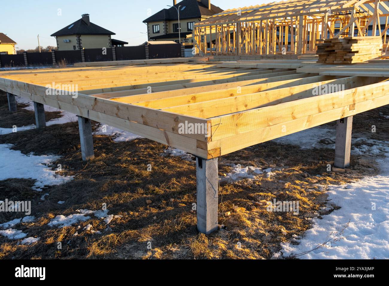 The foundation of a wooden frame house on stilts is a construction site ...