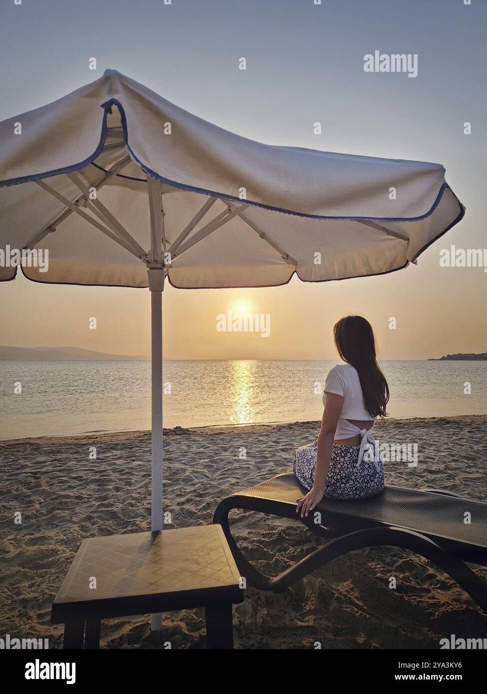 Young woman enjoying beautiful sunrise hi-res stock photography and ...