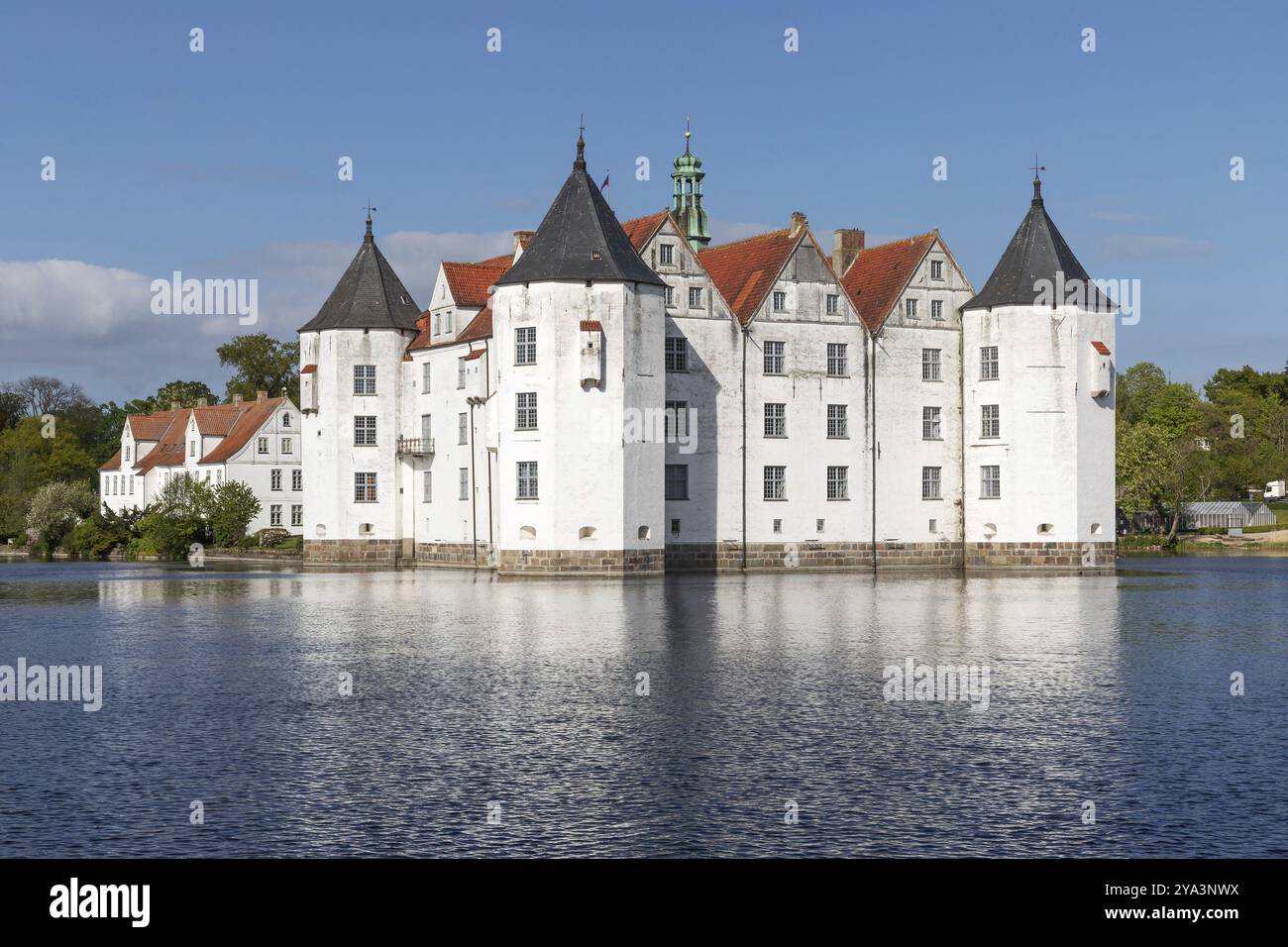 Gluecksburg moated castle in Schleswig-Holstein. With reflection in the ...