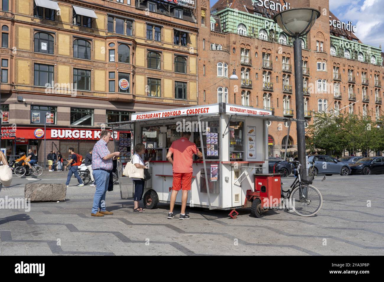Copenhagen, Denmark, July 14, 2023: Customers at a traditional hot dog ...
