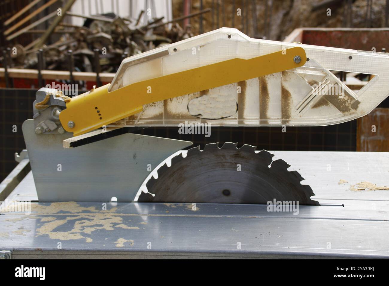 Hand guard on a circular saw was blocked by a piece of wood Stock Photo ...