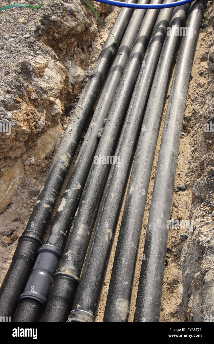 Empty conduits for electricity and water pipes on a construction site ...