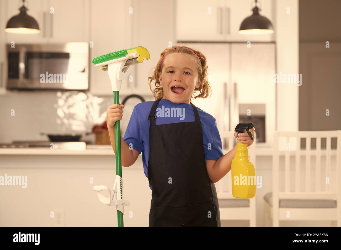 Kid helping with housework, cleaning. Little kid cleaning at home ...