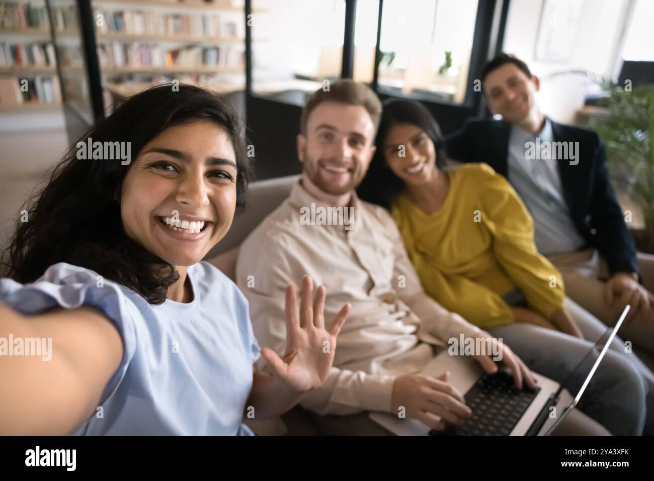Happy young Indian manager girl taking selfie with office friends Stock ...