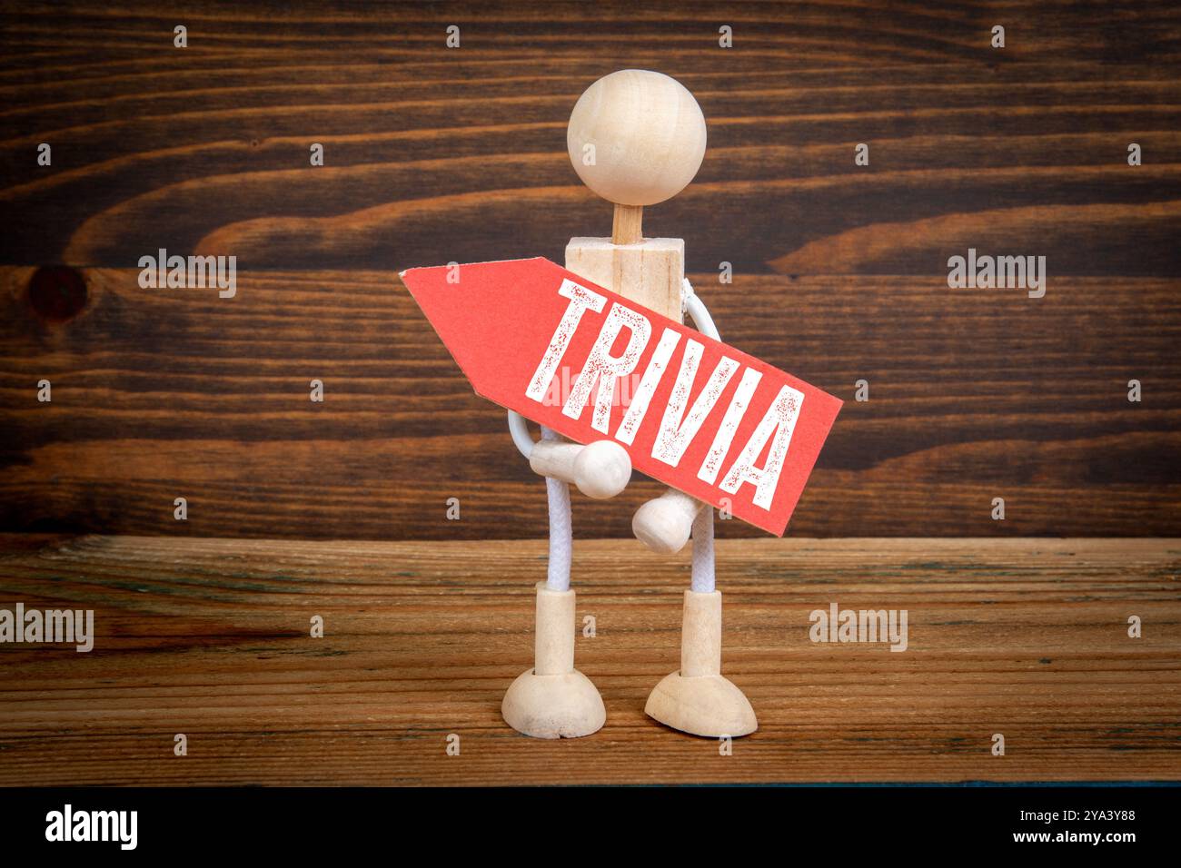 TRIVIA. Red pointing arrow with text. Miniature human figures Stock ...
