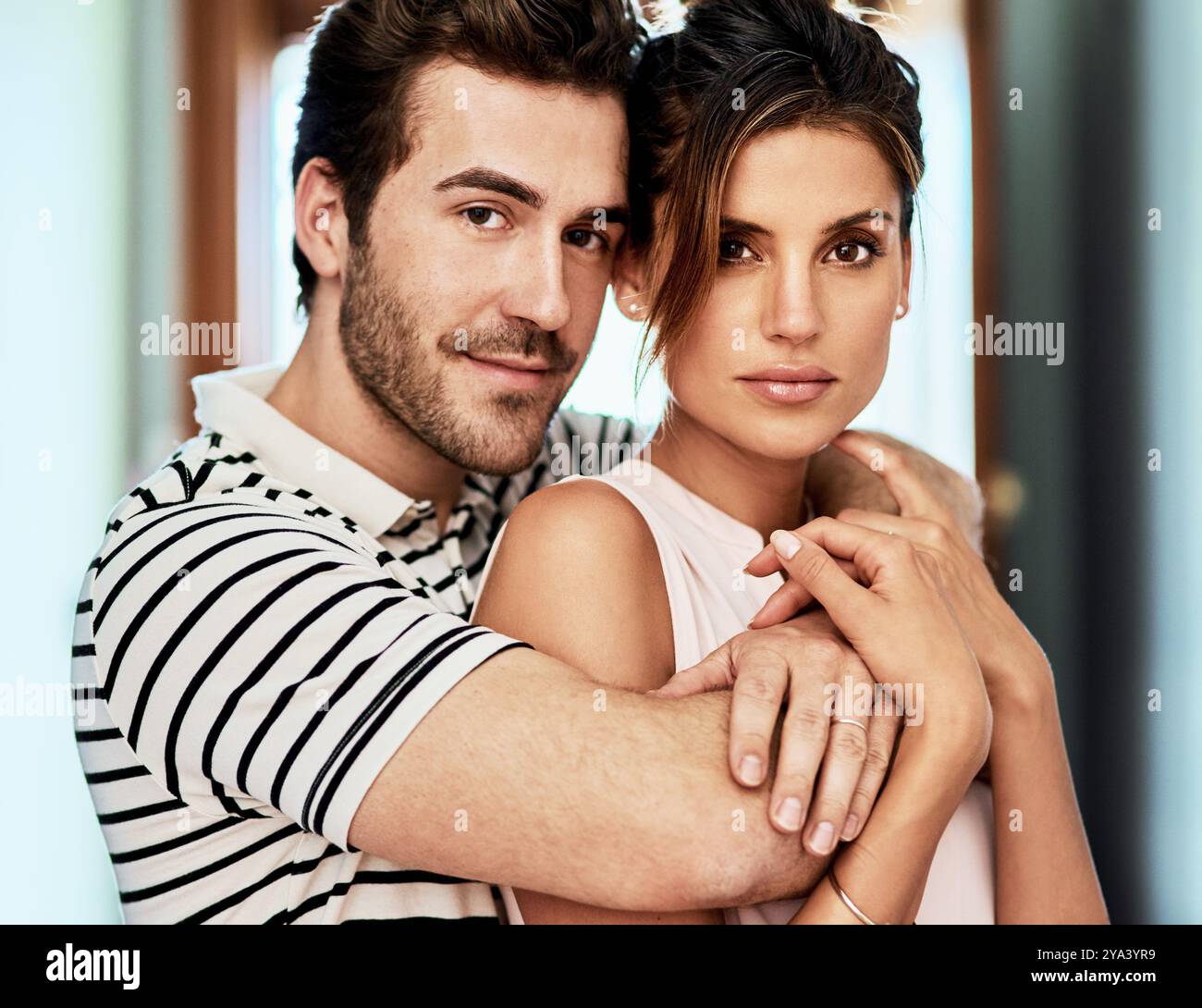 Loyalty, portrait and couple hug in home with trust and love for care ...