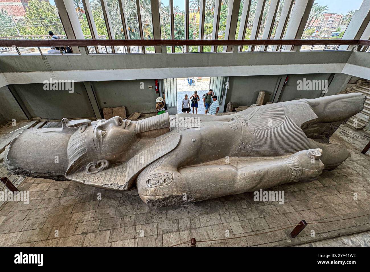 Giza, Egypt. 11th Oct, 2024. Tourists look at the statue of ancient ...