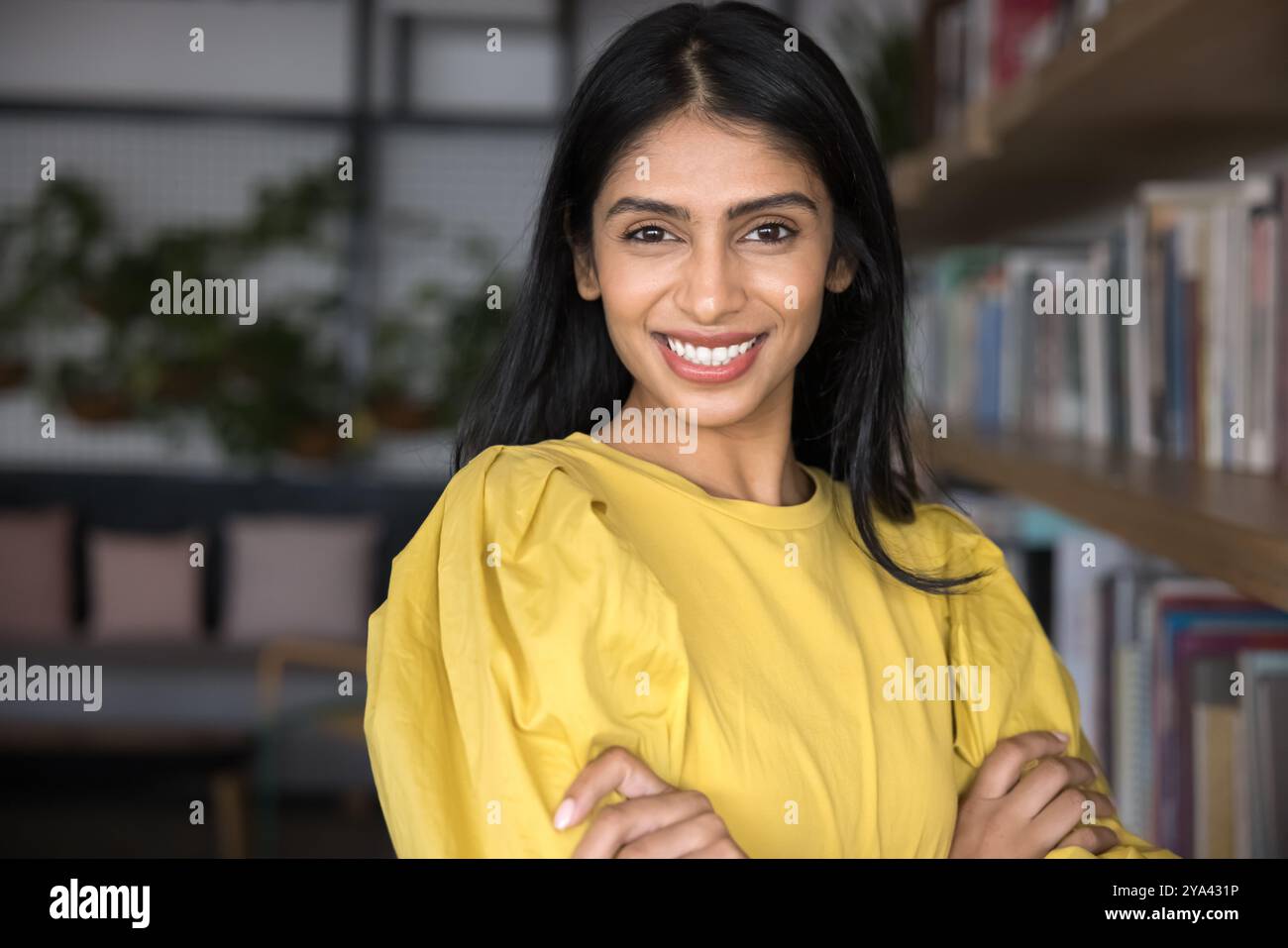 Cheerful confident Indian student girl standing with hands folded Stock ...