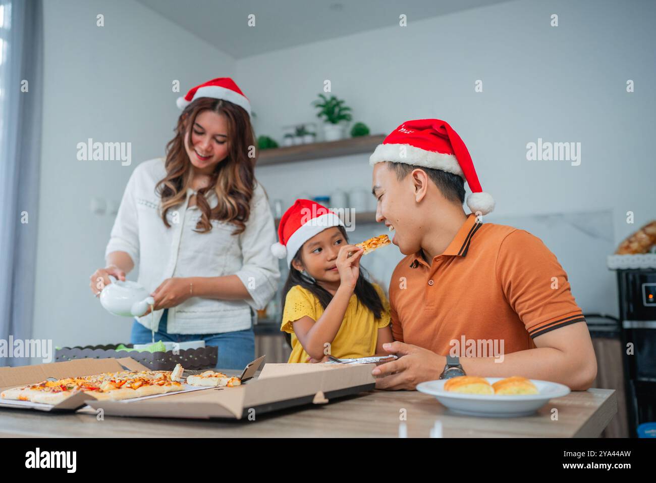 sweet gesture little girl feeding father christmas eve Stock Photo - Alamy