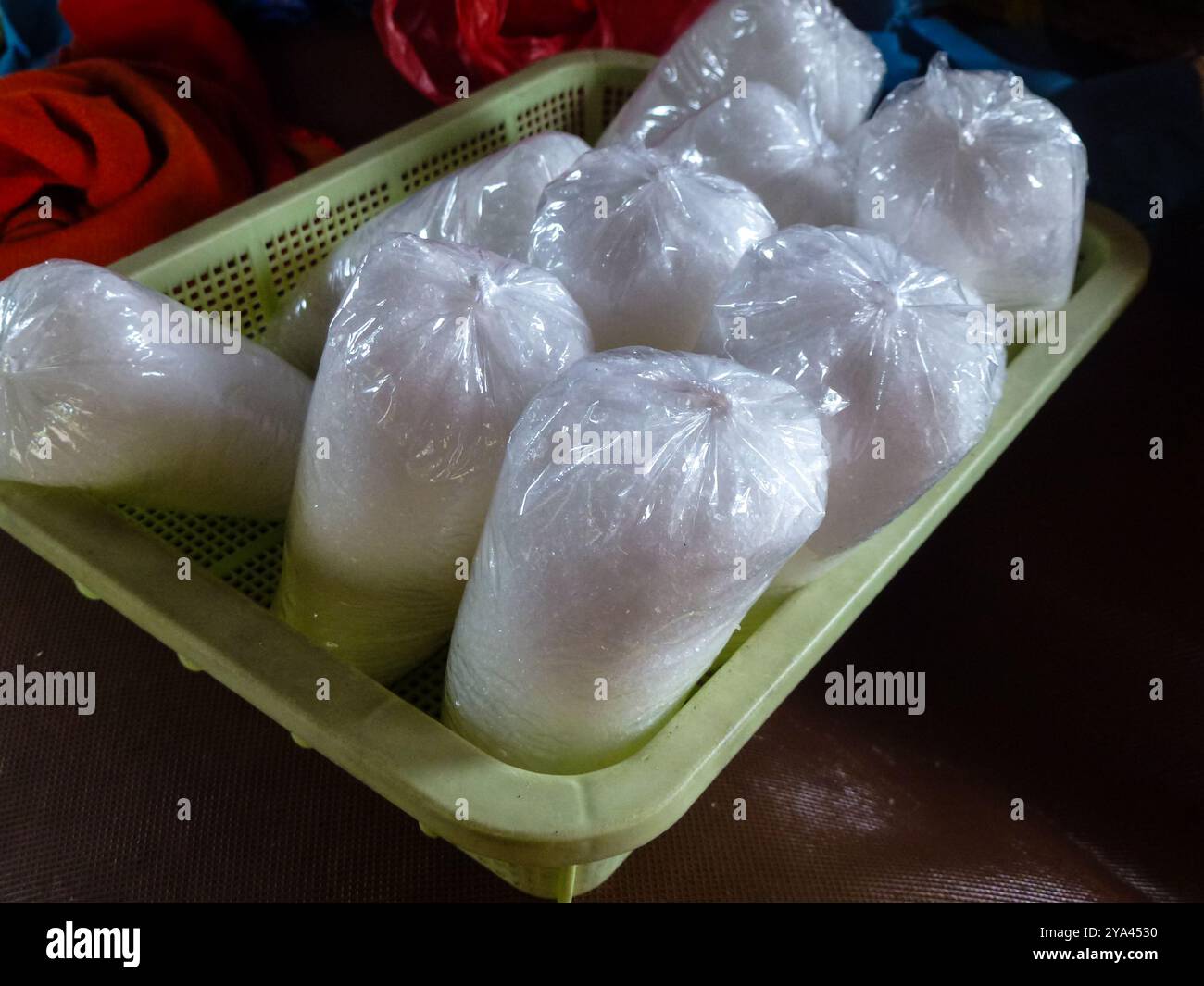 Traditional sea salt production by a salt farmer on the black lava ...