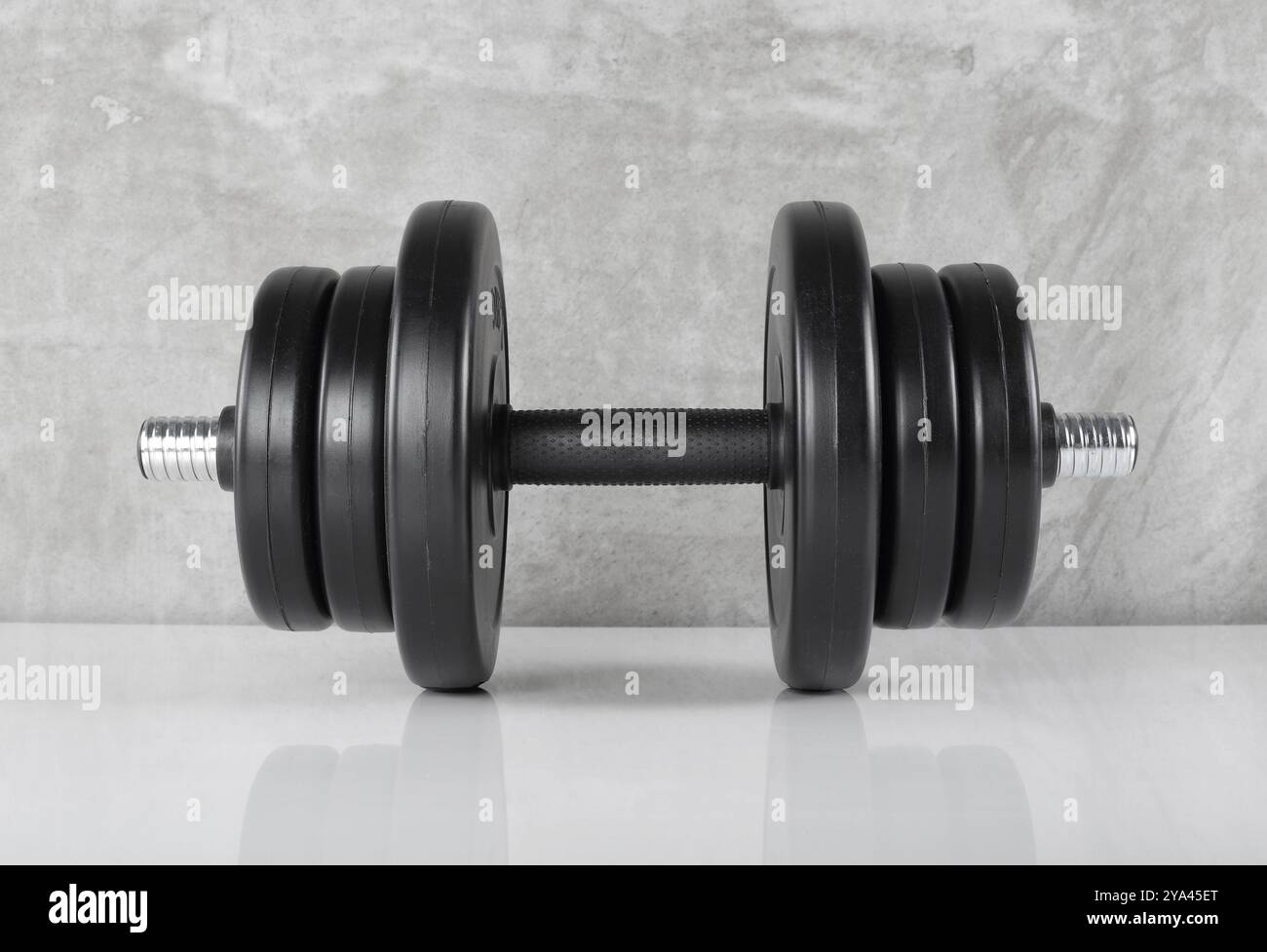 Sport and fitness - Front view Black dumbbell with six weights concrete ...