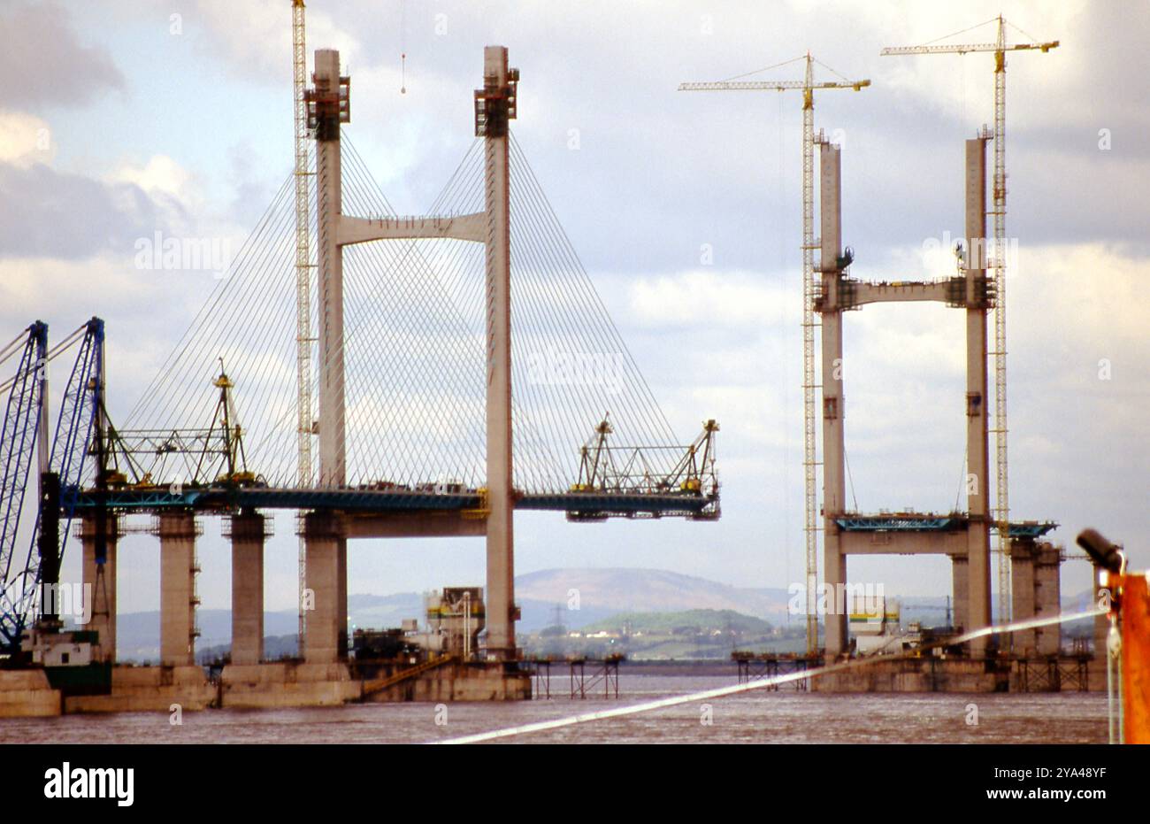 The road deck sections slowly moving out from the cable stay tower ...