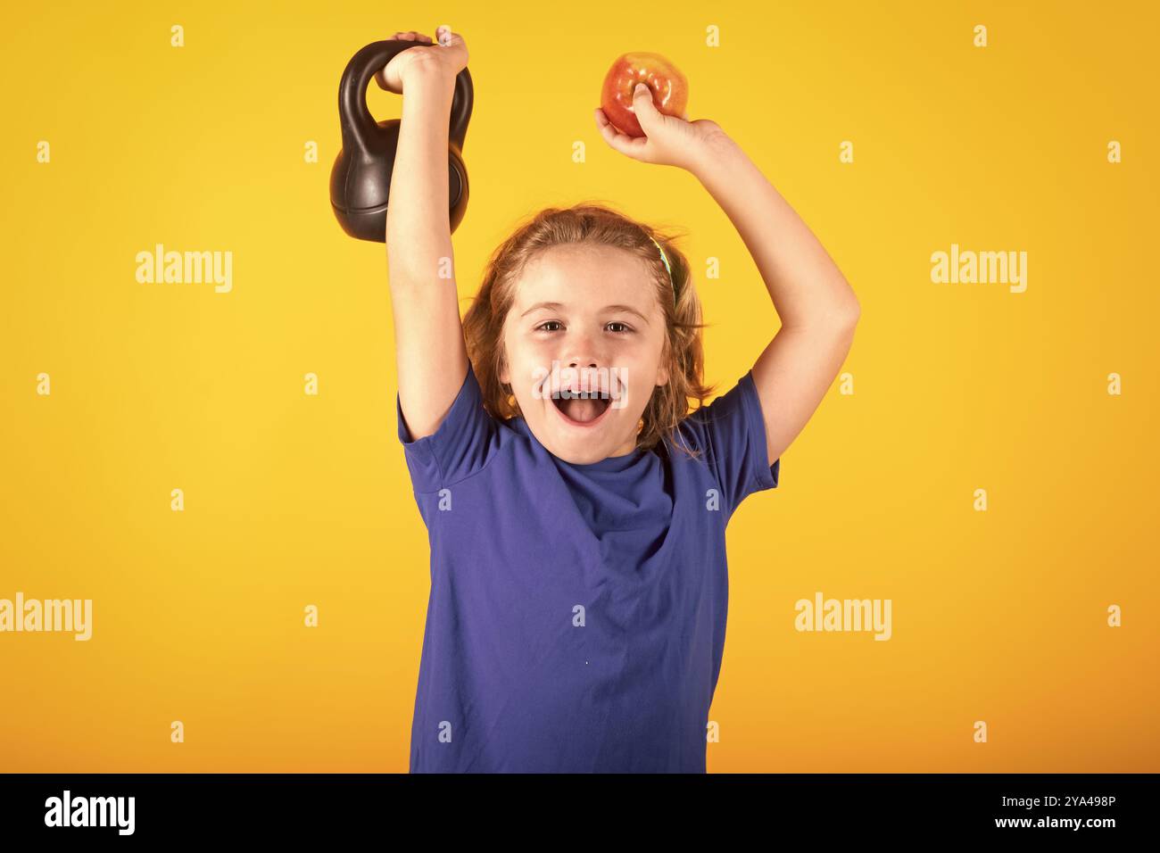 Child boy raising a dumbbell. Cute child training with dumbbells. Kids ...