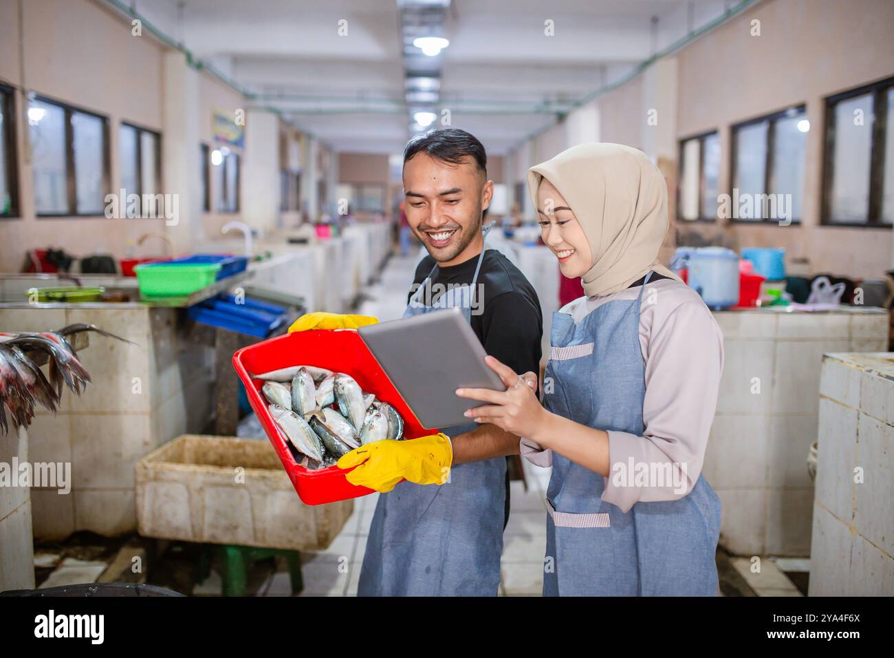 Aquaculture Workers Engaging in Collaborative Efforts at a Fish Processing Facility Stock Photo ...
